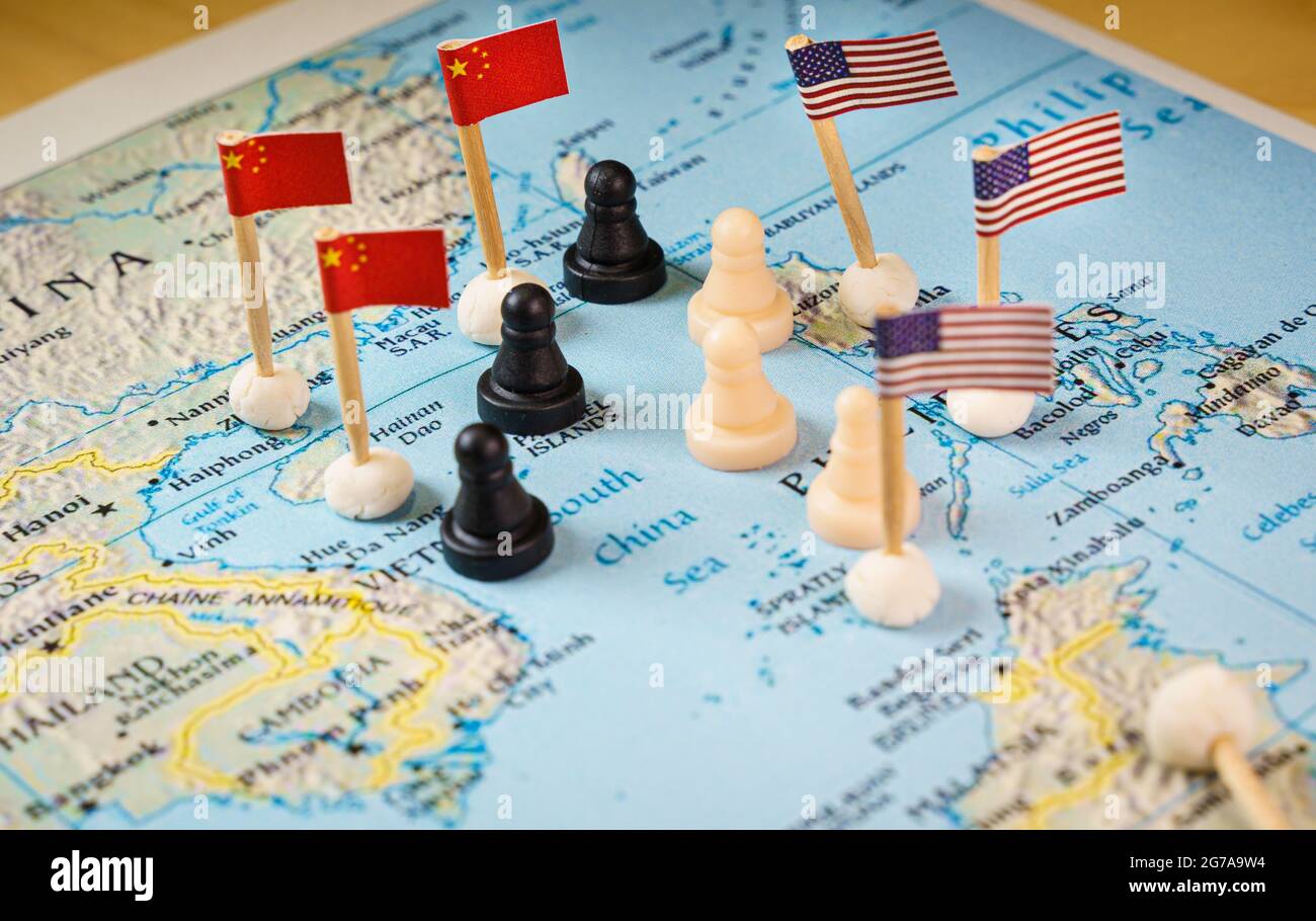 Chinese and U.S. flags with chess pieces symbolizing the conflict and ...