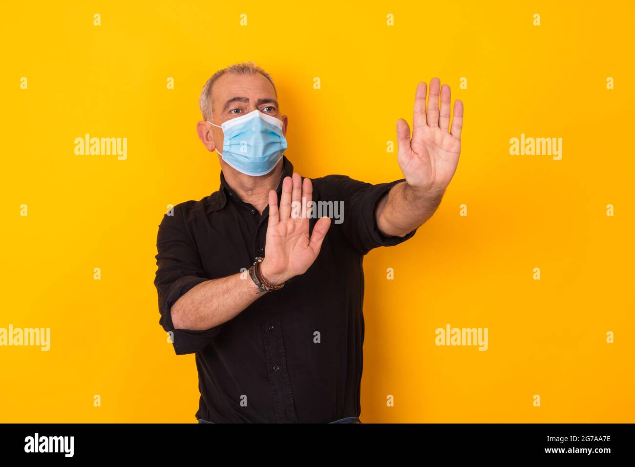 adult man with mask isolated with stop expression Stock Photo - Alamy
