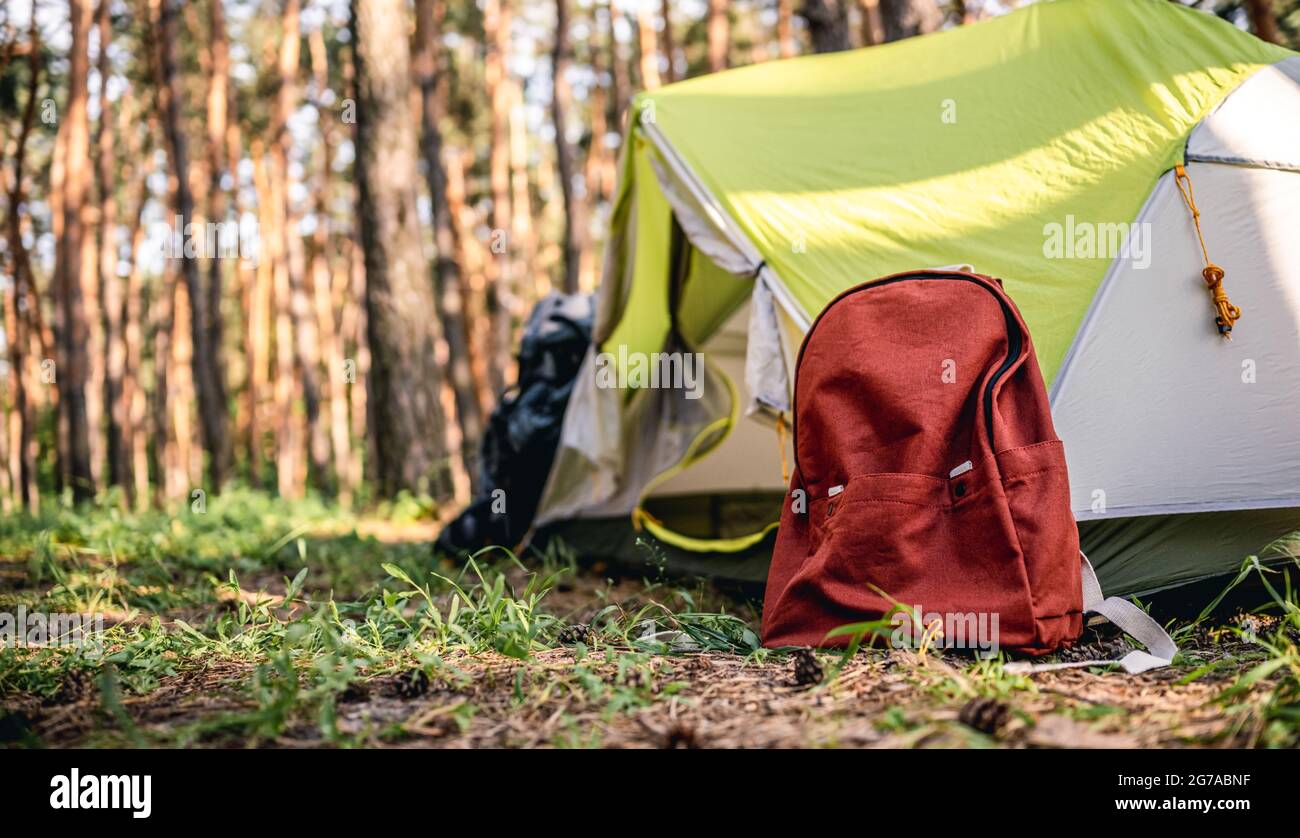 Tent and backpack in the forest Stock Photo - Alamy