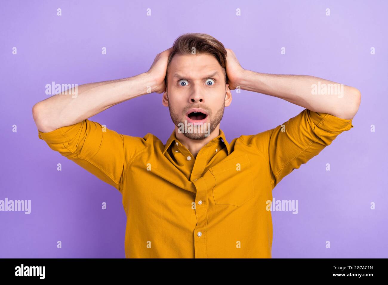 Portrait of attractive amazed worried guy sudden news reaction isolated ...