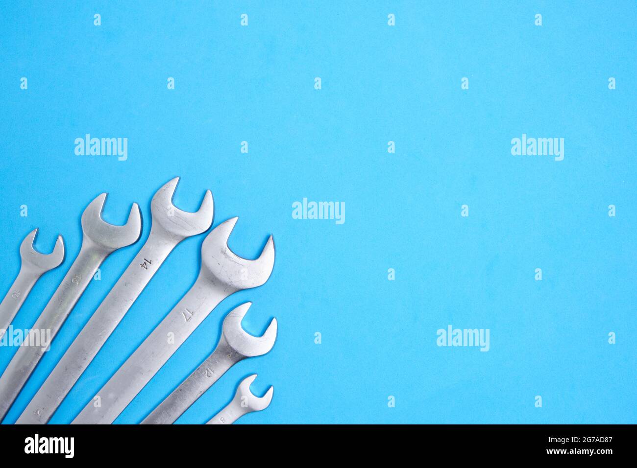 Set of wrenches on a blue background Stock Photo - Alamy