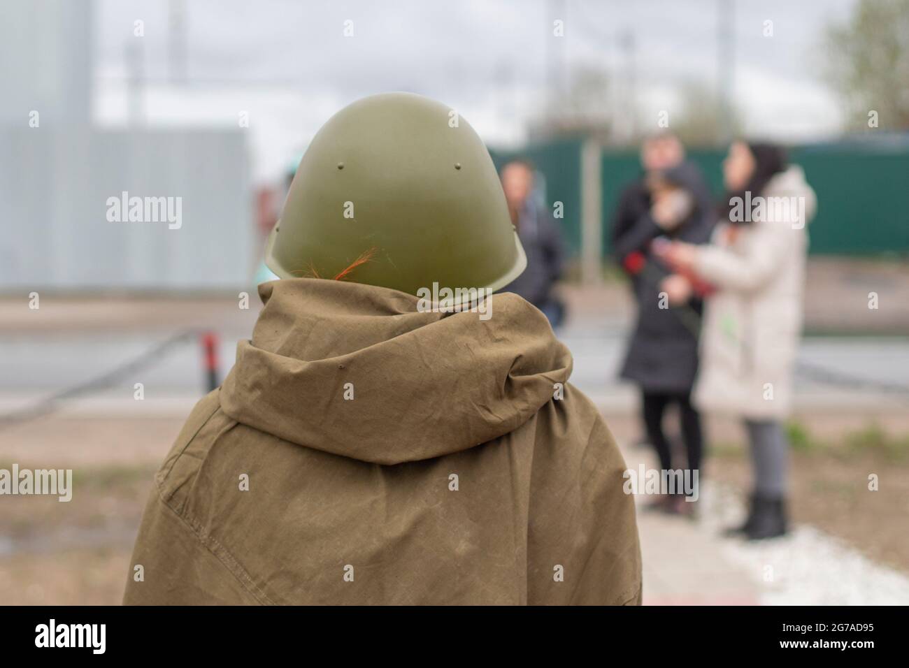 A soldier in a helmet. Military from the back. Military uniform from ...