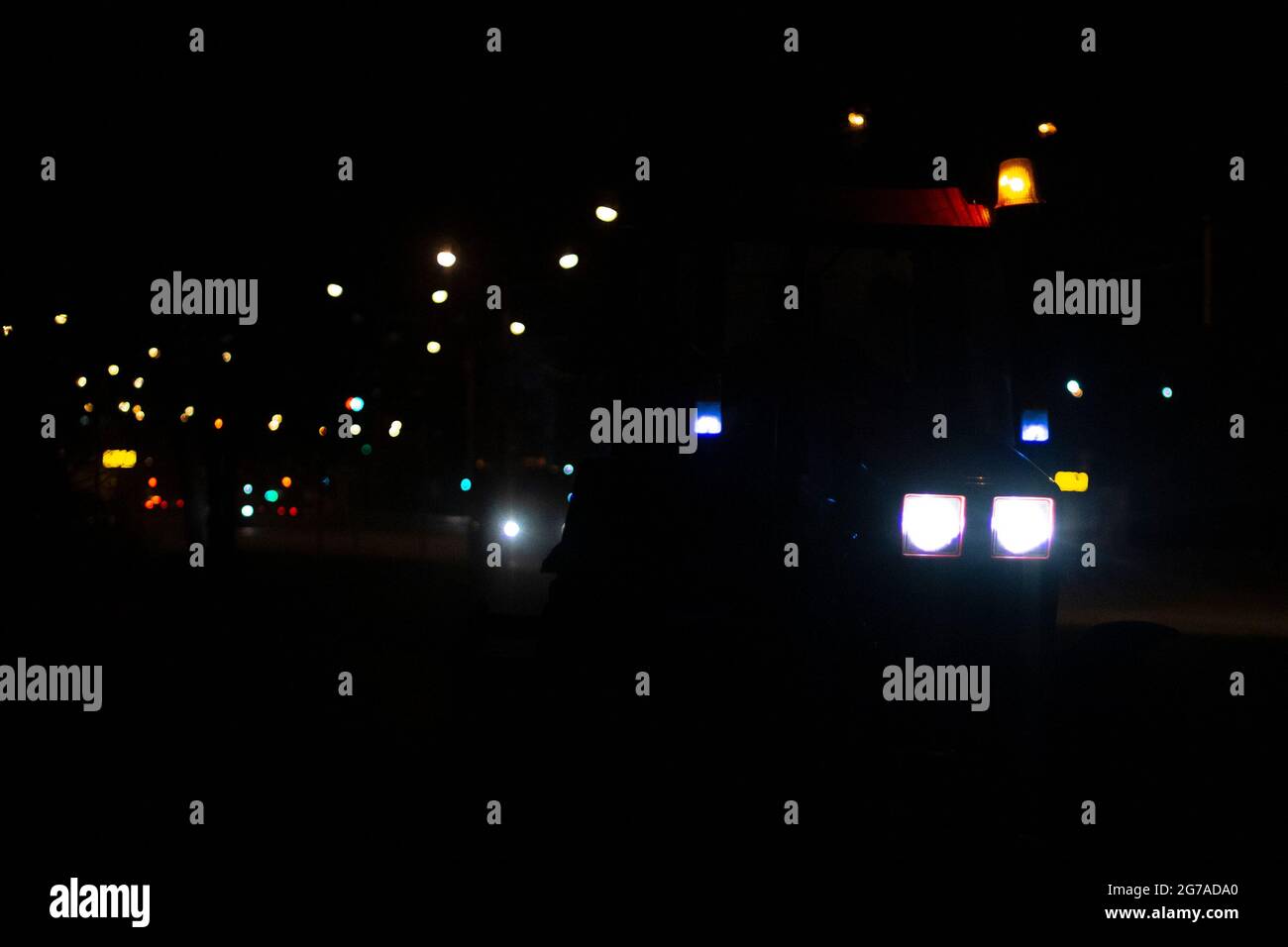 City lights at night. Lights in the dark. Electric light sources in a ...