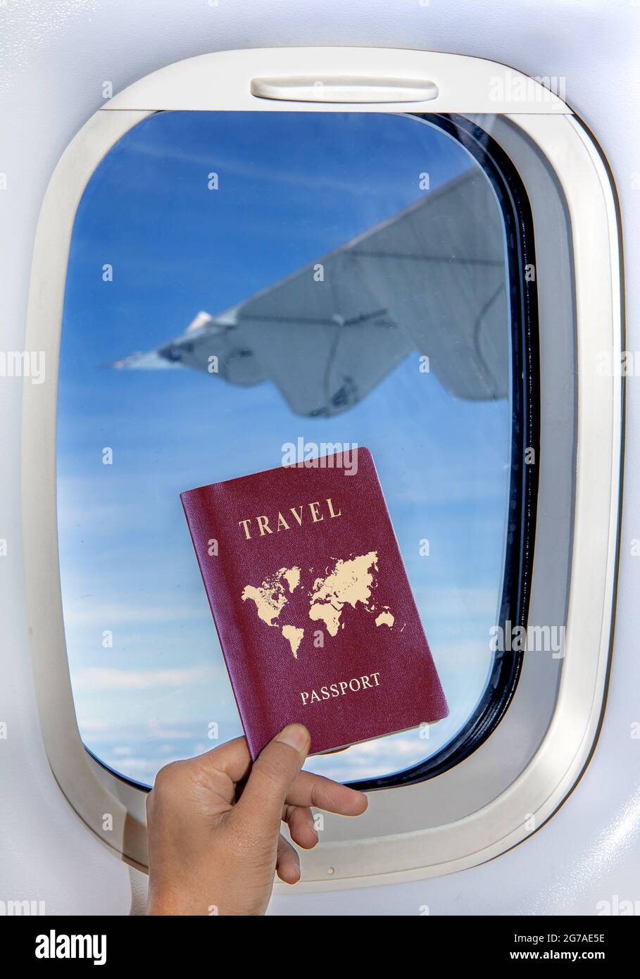 Traveler shows a passport in a flying plane Stock Photo - Alamy