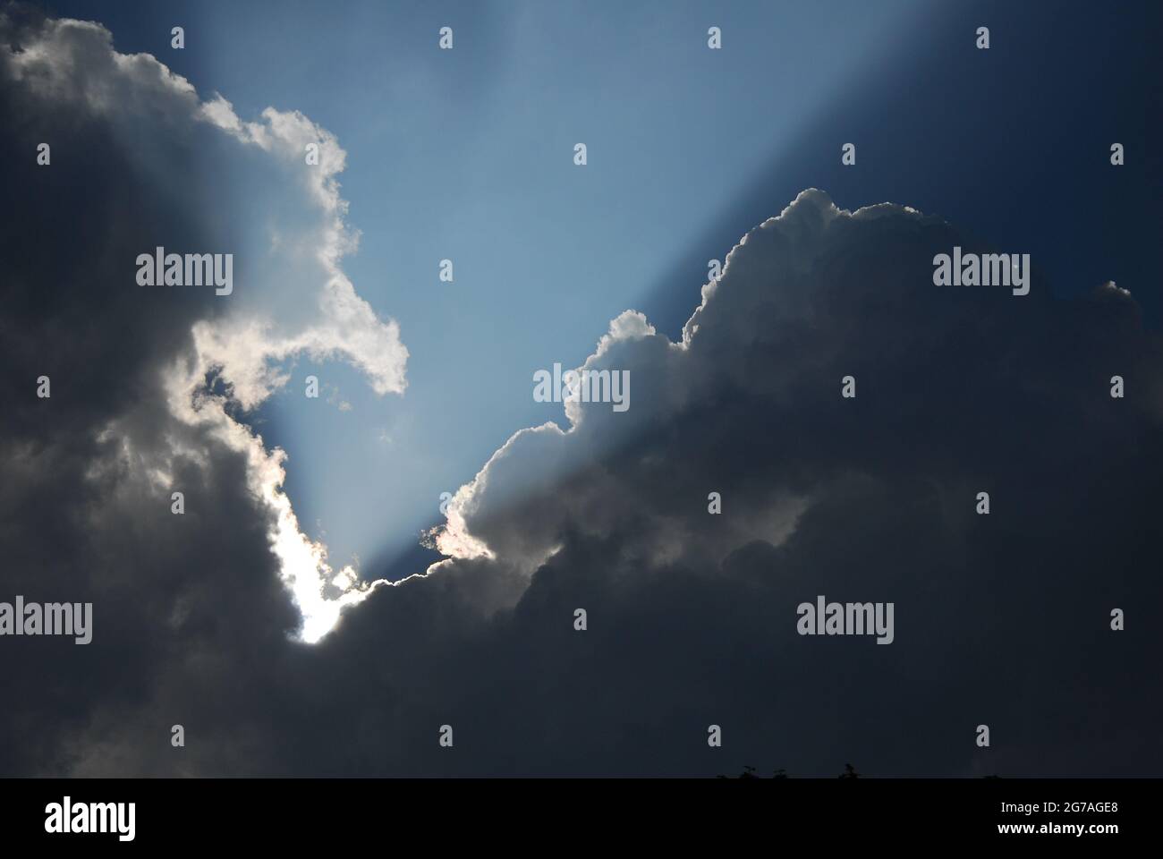Storm clouds, clouds, blue sky, airplane trace Stock Photo - Alamy