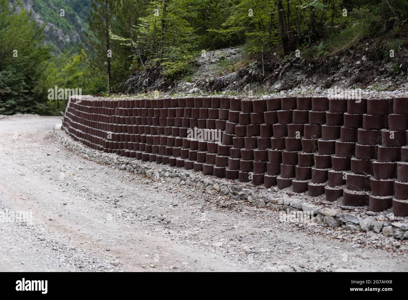 repairing a road in the mountains. Road repaired after a landslide ...