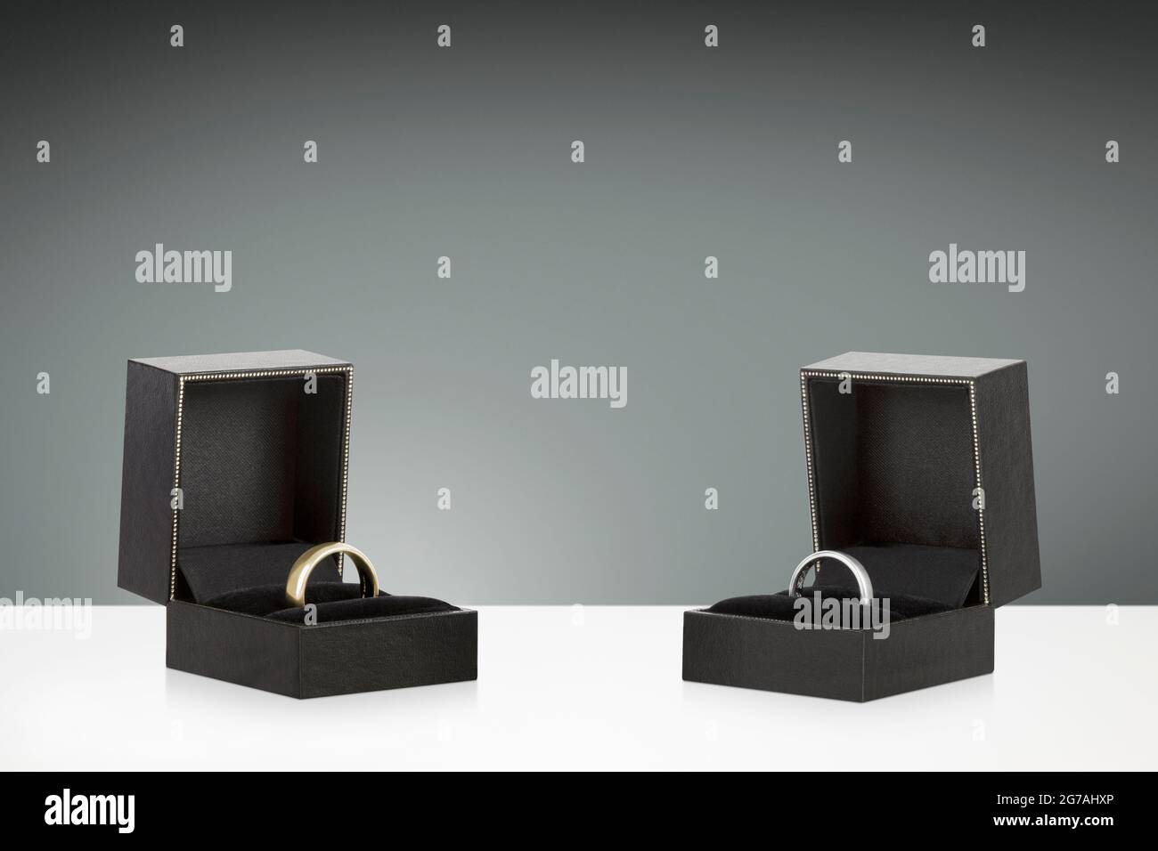 Bride and Groom gold and white gold wedding rings in there boxes on a ...