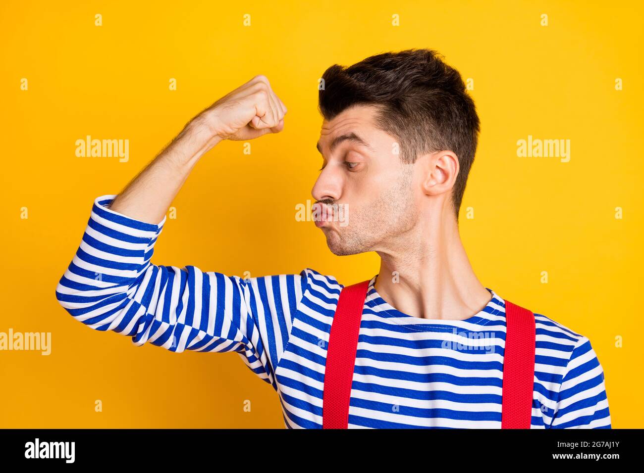 Profile side photo of young handsome man sailor showing kissing biceps ...