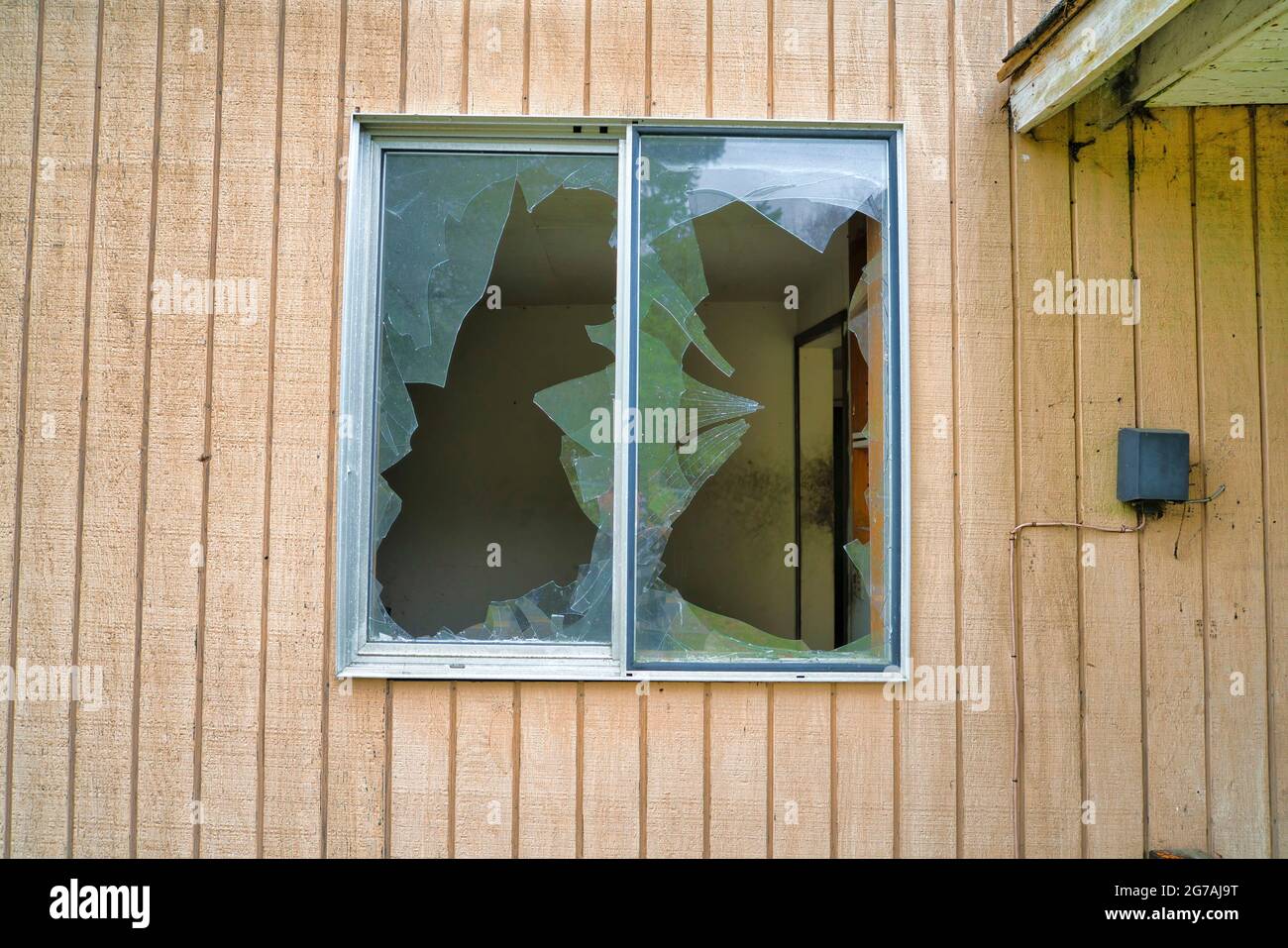 Broken glasses on the window of an old abandoned house in Washington ...