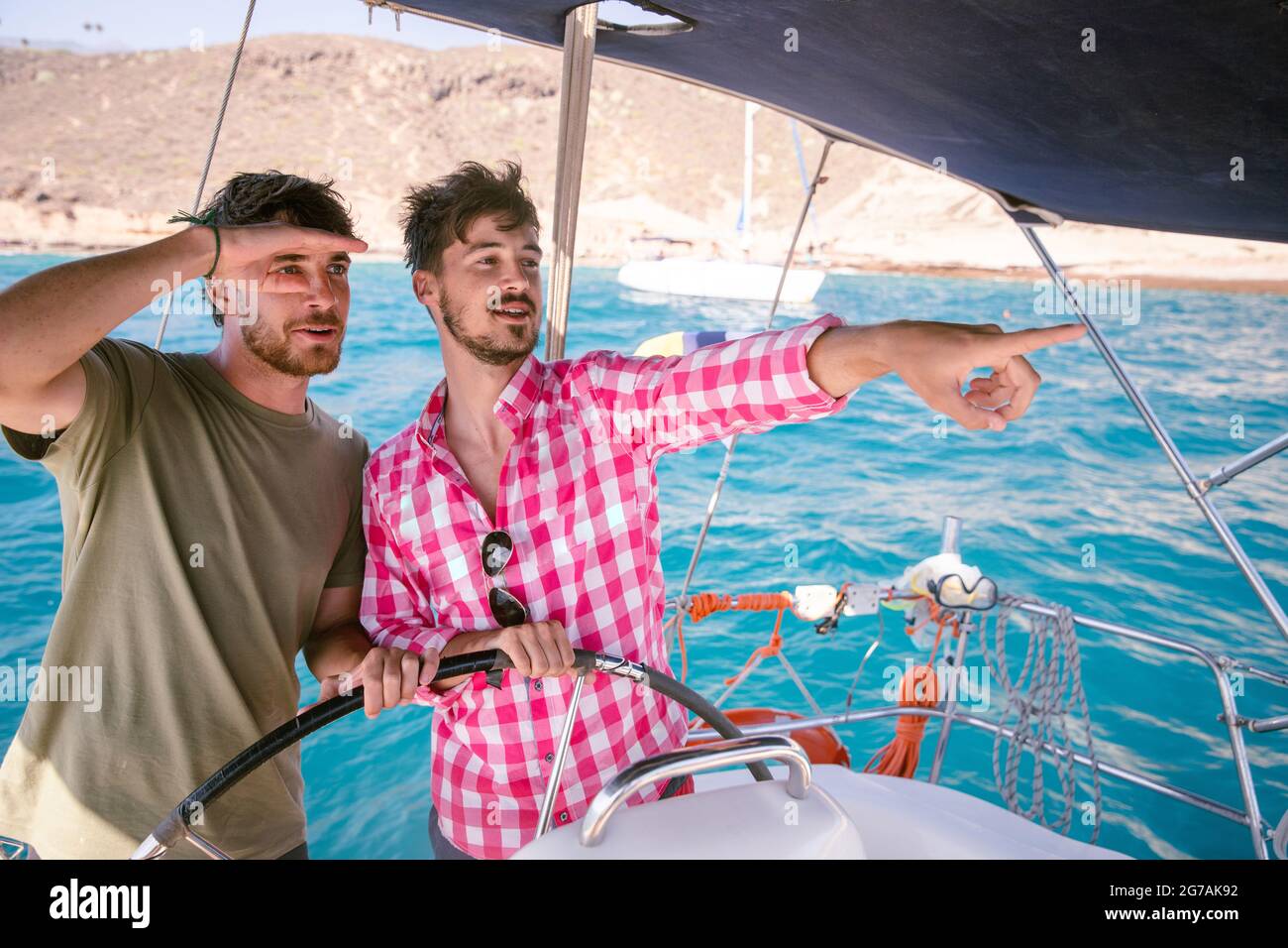 Boy driving boat hi-res stock photography and images - Alamy