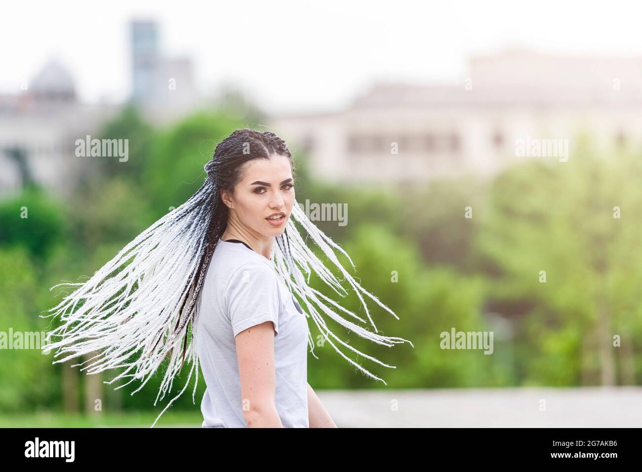 Urban young woman with african braids. Fashion of youth Stock Photo - Alamy