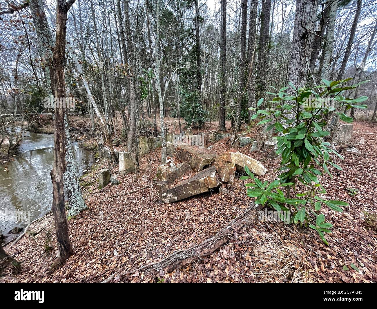 Brick ruins and river with fall foliage in a forest in rural Georgia ...