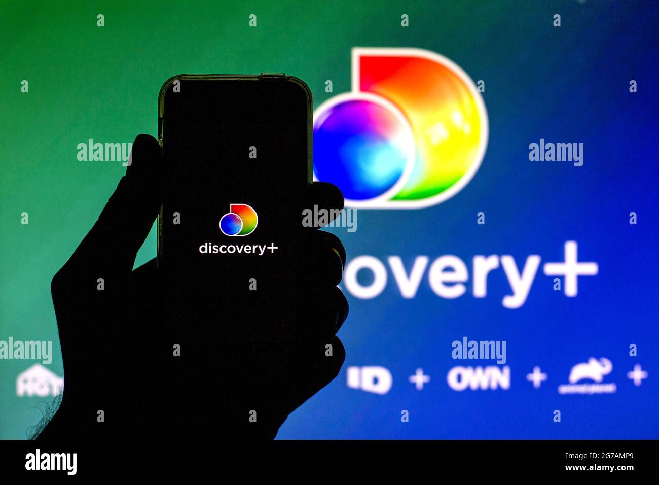 In this photo illustration, a Discovery+ logo seen displayed on a ...