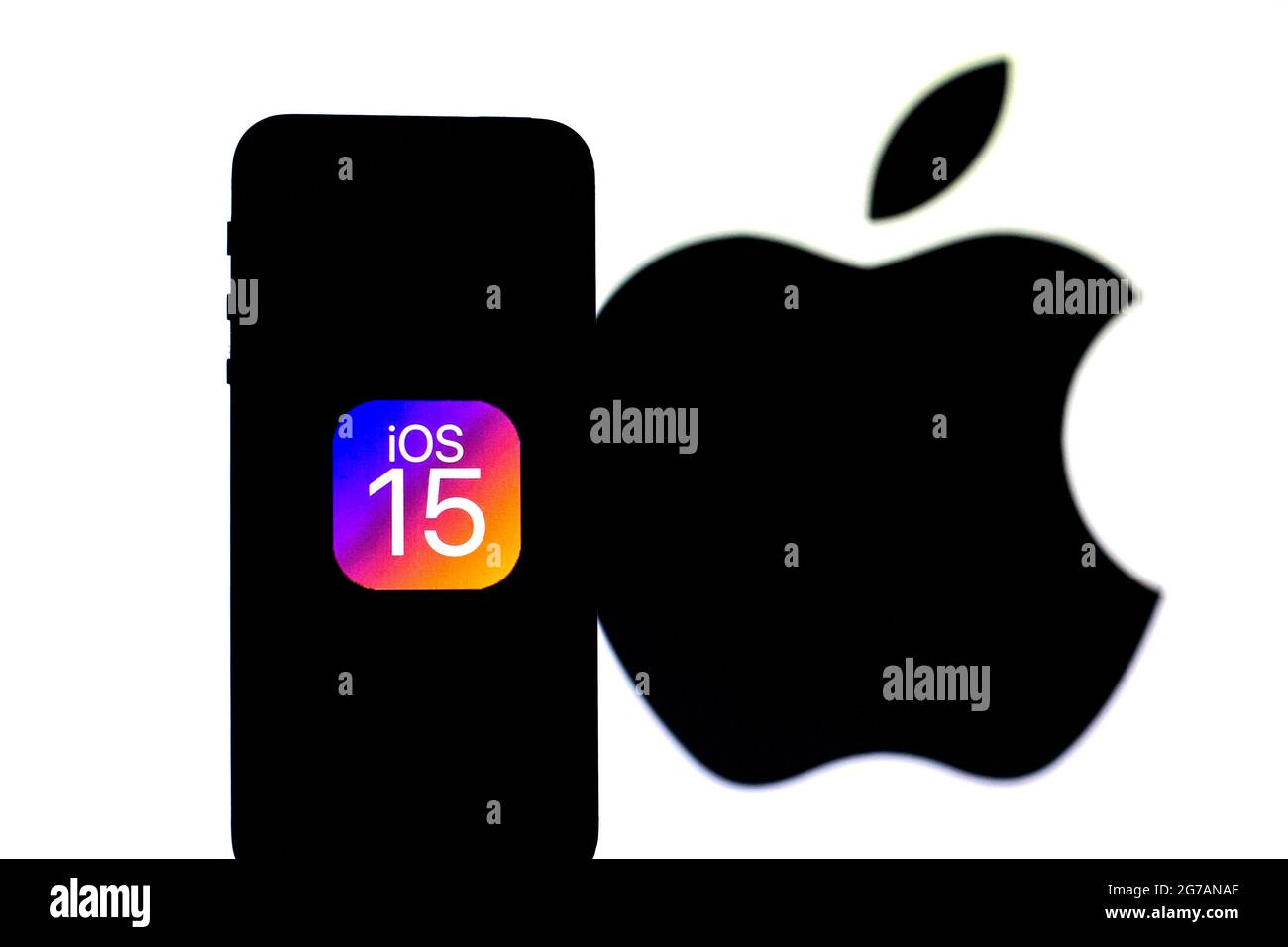 In this photo illustration an iOS 15 logo seen displayed on a ...