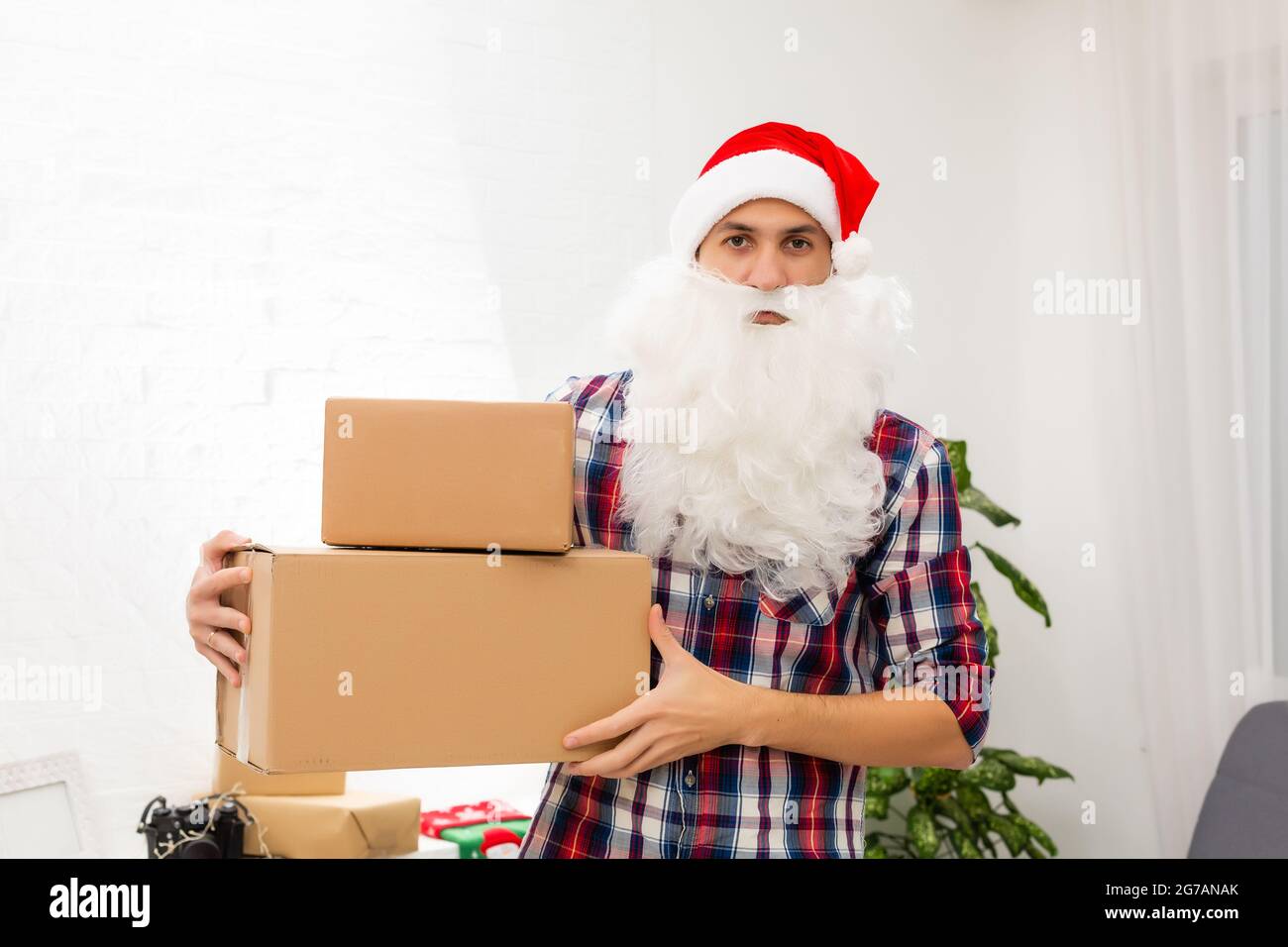 santa claus carrying a cardboard box on white background Stock Photo ...