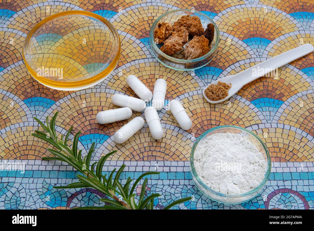 Close-up of medicines with ingredients in cups around them Stock Photo ...