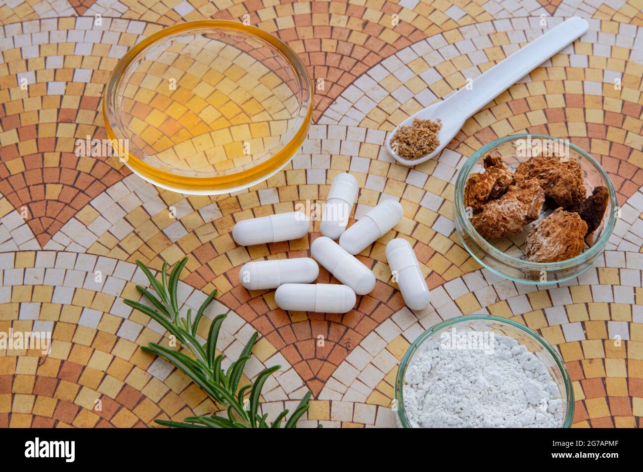 Close-up of medicines with ingredients in cups around them Stock Photo ...