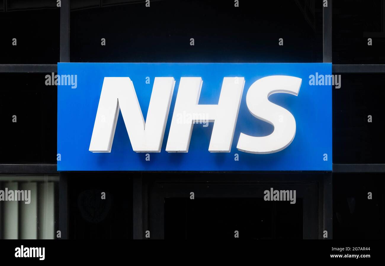 NHS sign over entrance to a city centre clinic in Liverpool Stock Photo ...