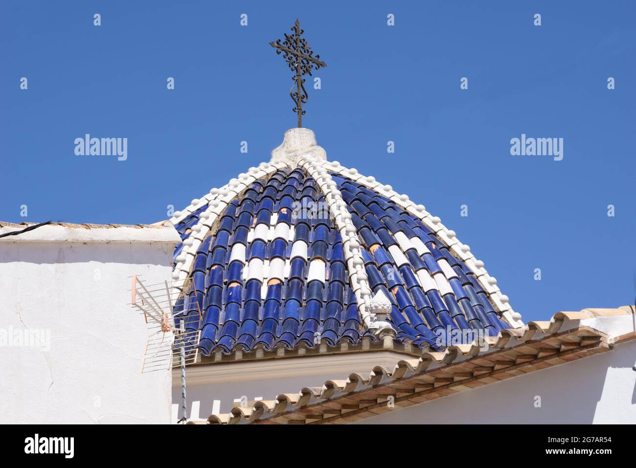 Typical Mediterranean blue and white dome with ornate black wrought ...