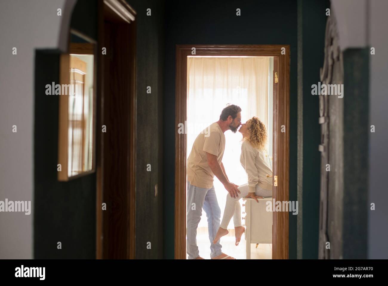 Romantic couple kissing at home - happy relationship man and woman ...