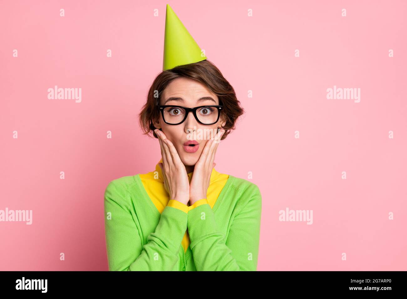 Photo of shocked pretty young woman birthday surprise wear cone hat ...