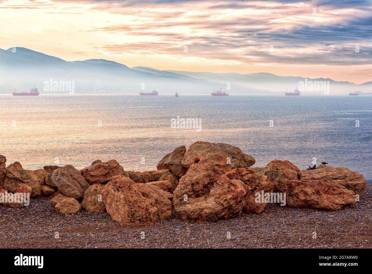Morning foggy seascape with ships on the roadstead Stock Photo - Alamy