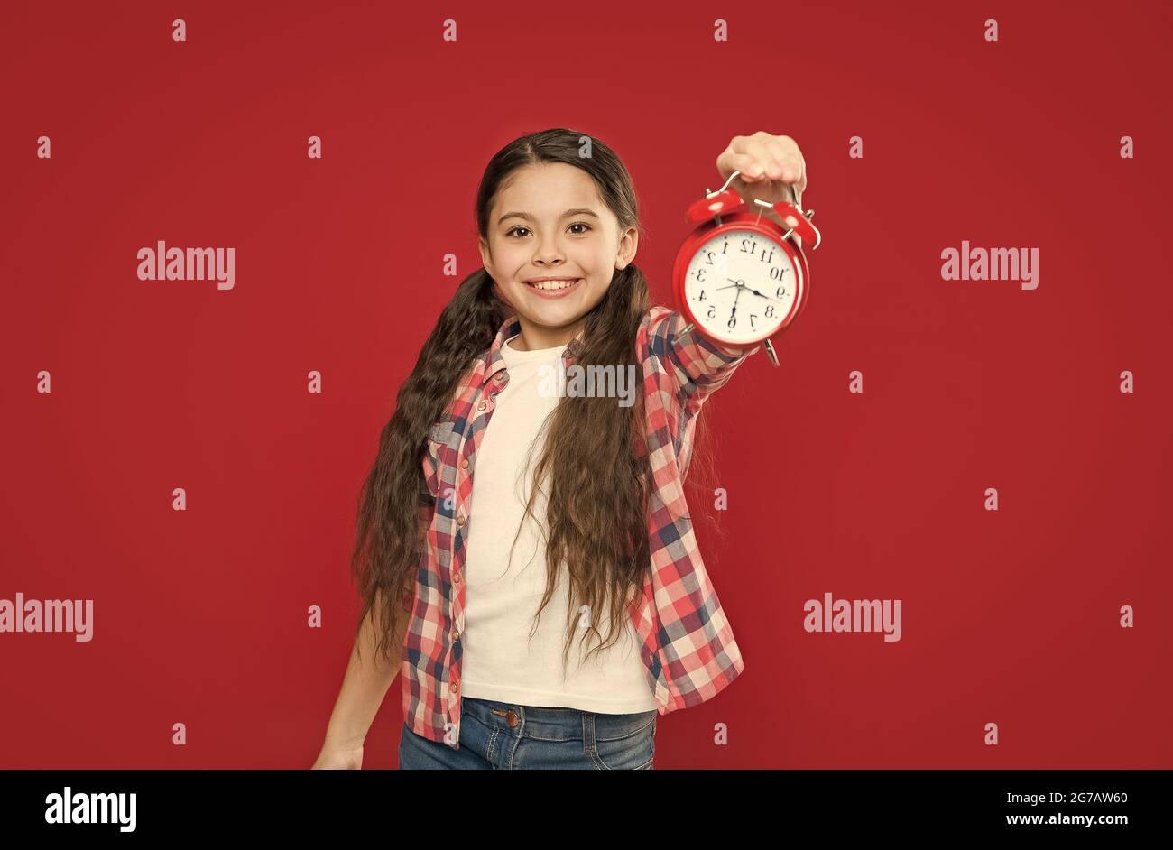 cheerful kid girl showing time on vintage watch, schedule Stock Photo ...