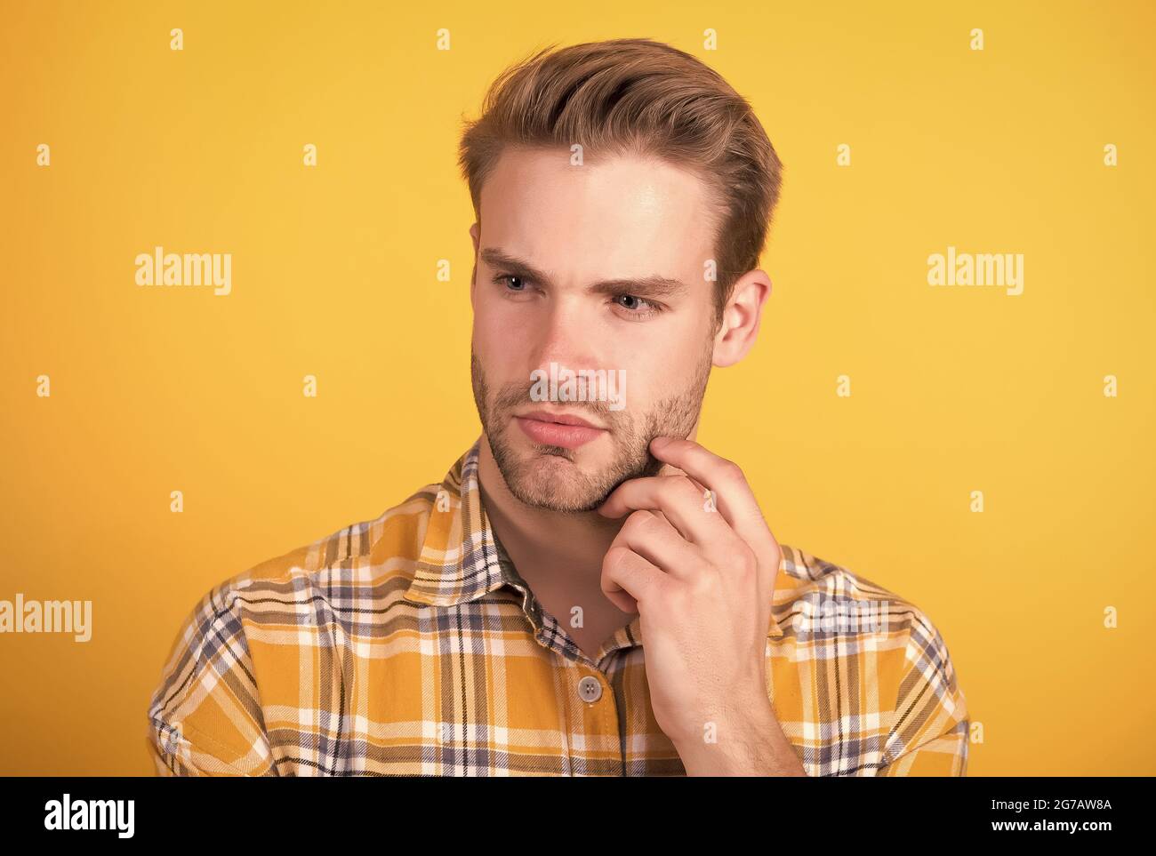 Facial care. Handsome man with unshaven face yellow background. Young ...