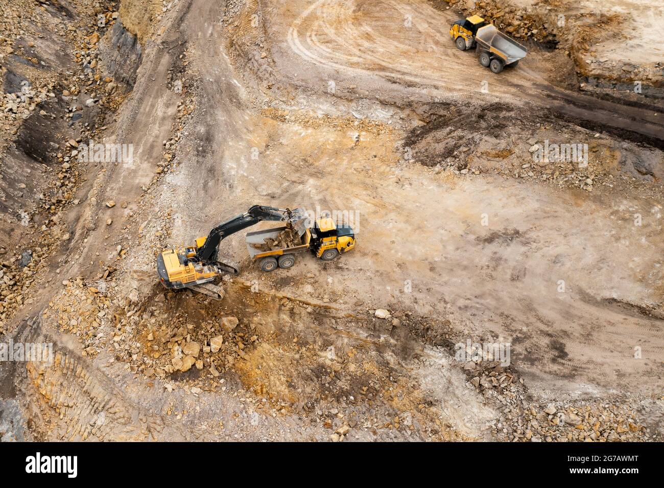 Aerial view of excavators digging ground. Opencast mining quarry Stock ...