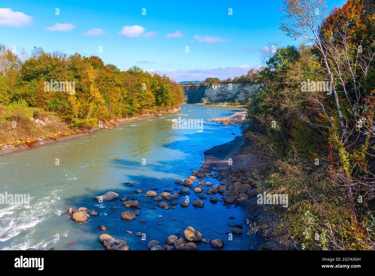 Landscape of the riverbed among the forest and steep terrain Stock ...