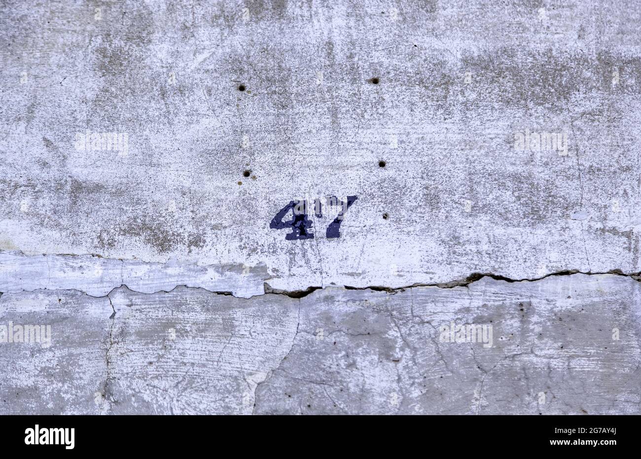 Detail of odd number on the wall, direction sign Stock Photo - Alamy