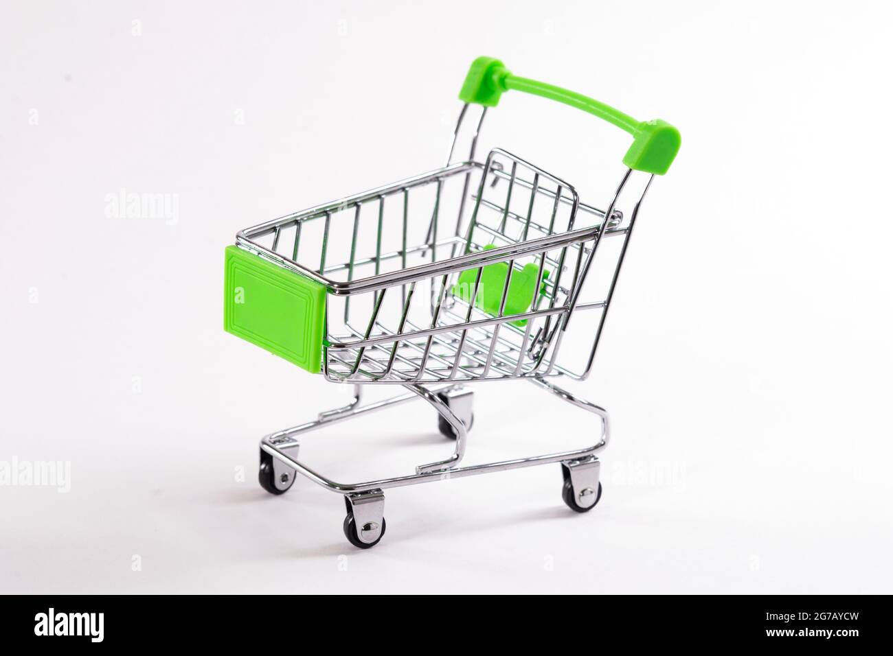 Mini shopping trolley on a white background Stock Photo - Alamy