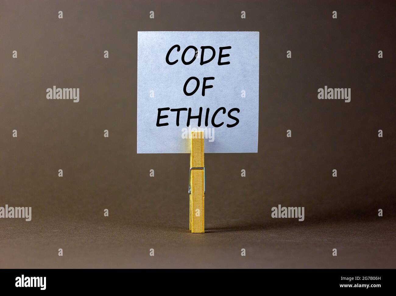 Code of ethics symbol. White paper with words 'Code of ethics', clip on ...