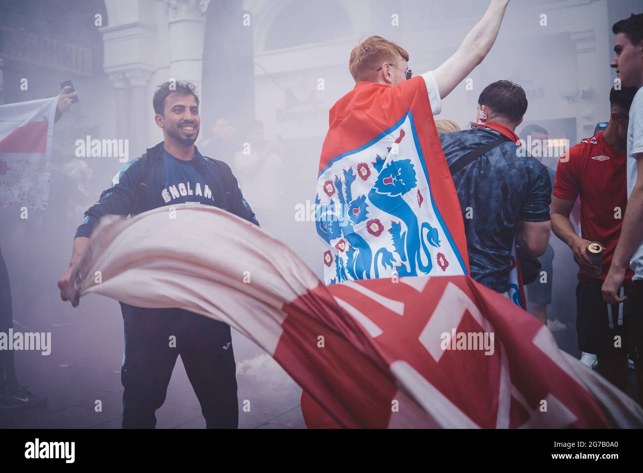 London | UK - 2021.07.12: English fans waving flags at Leicester Square ...