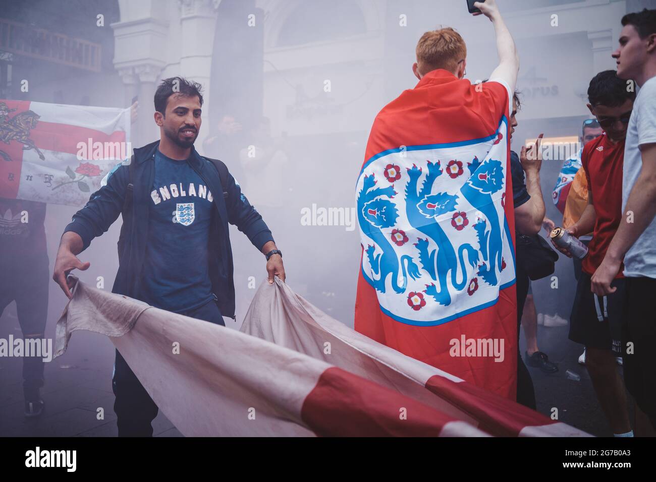 London | UK - 2021.07.12: English fans waving flags at Leicester Square ...