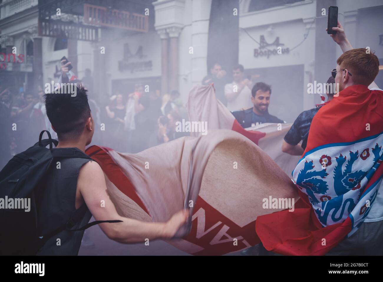 London | UK - 2021.07.12: English fans waving flags at Leicester Square ...