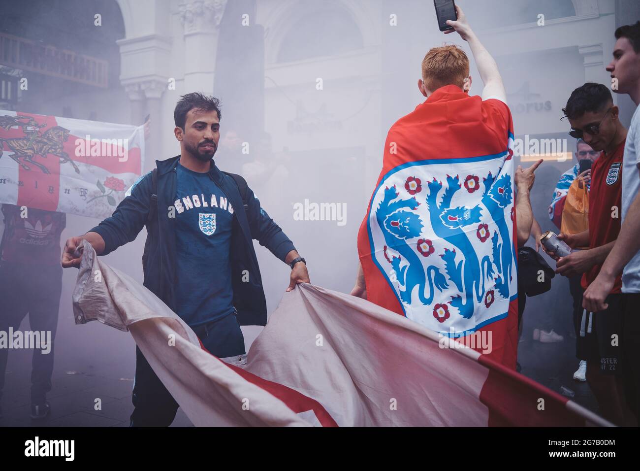 London | UK - 2021.07.12: English fans waving flags at Leicester Square ...