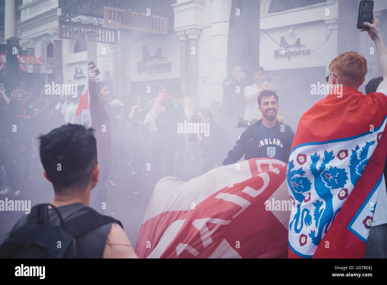 London | UK - 2021.07.12: English fans waving flags at Leicester Square ...