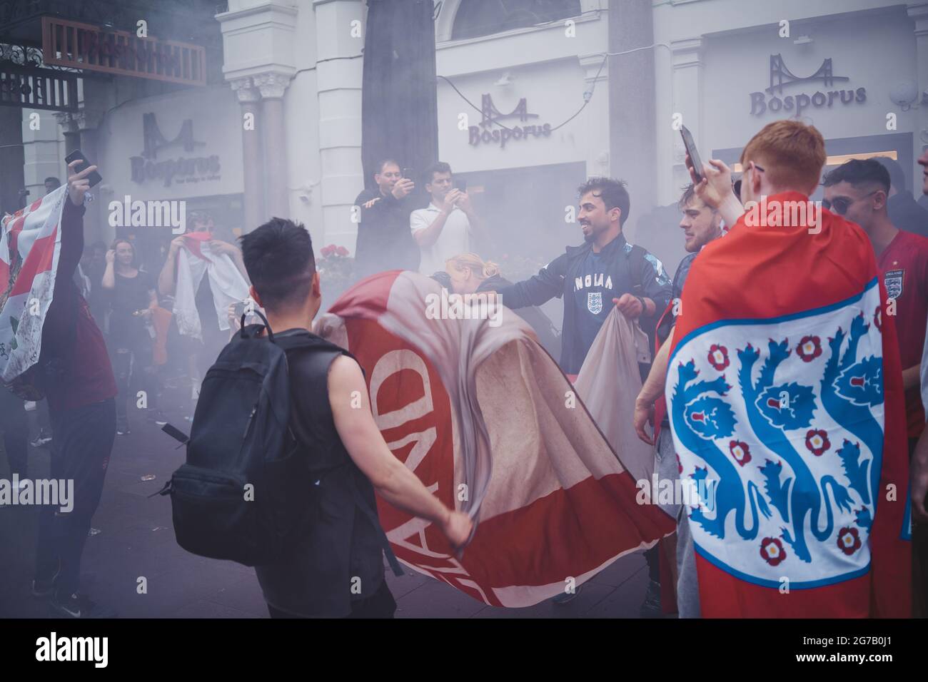 London | UK - 2021.07.12: English fans waving flags at Leicester Square ...