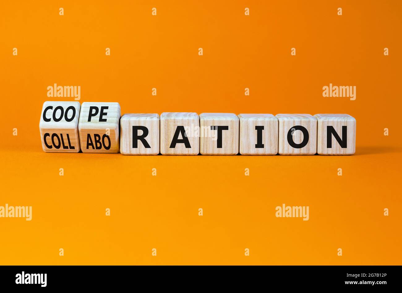 Cooperation or collaboration symbol. Turned wooden cubes, changed words ...