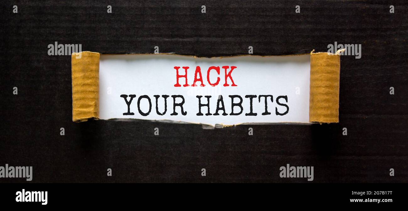 Hack your habits symbol. Words 'Hack your habits' appearing behind torn ...