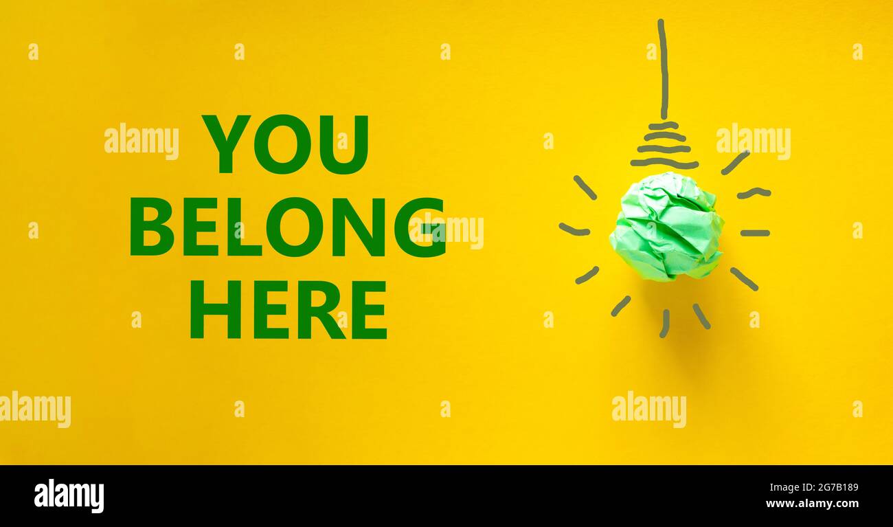 You belong here symbol. Green shining light bulb icon. Words You belong ...