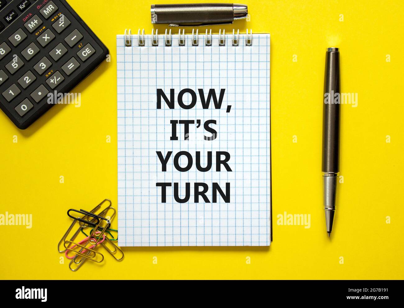 Now it is your turn symbol. Words 'Now it is your turn' on white note ...