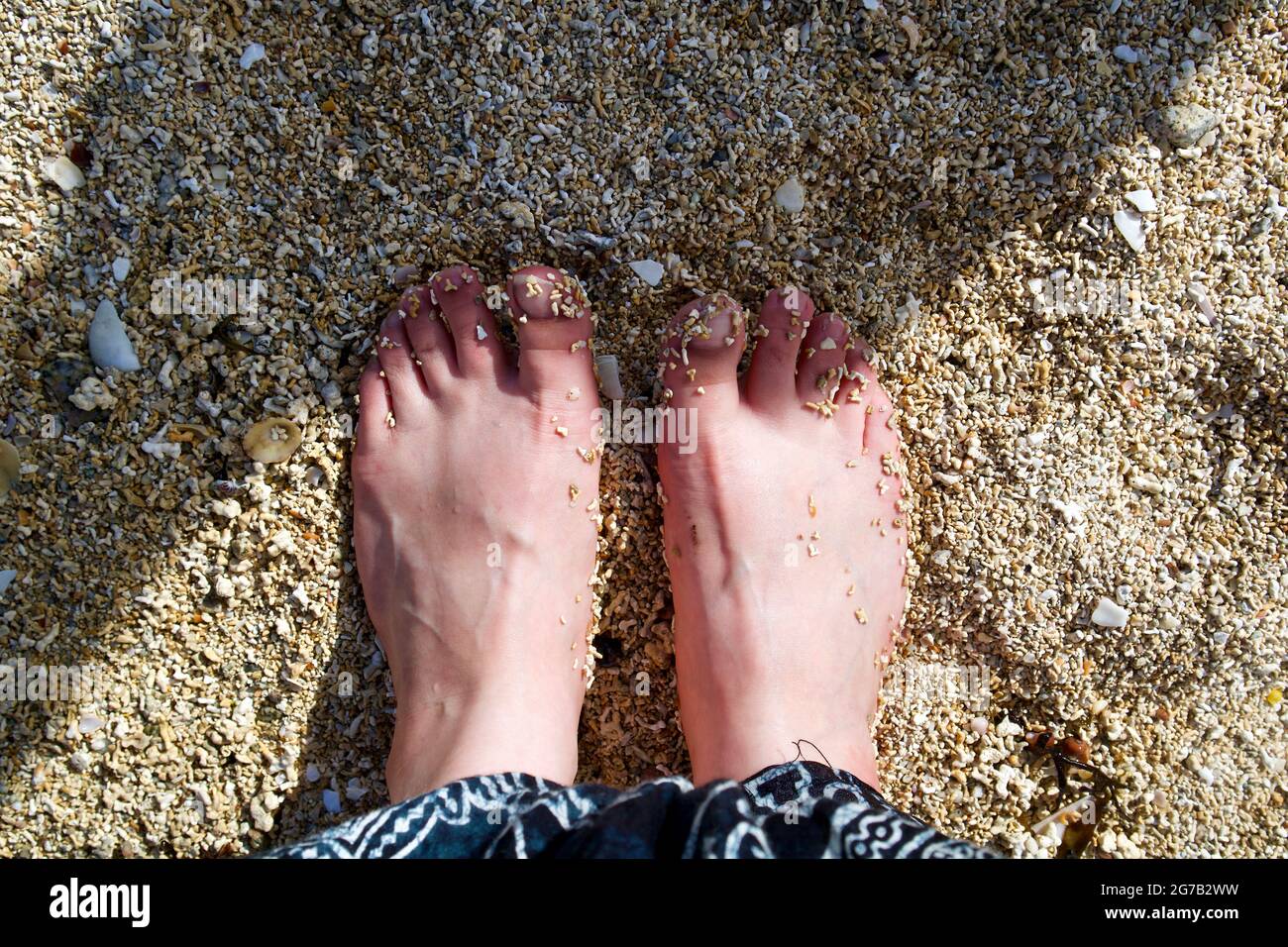 Feet with a side of coral Stock Photo - Alamy