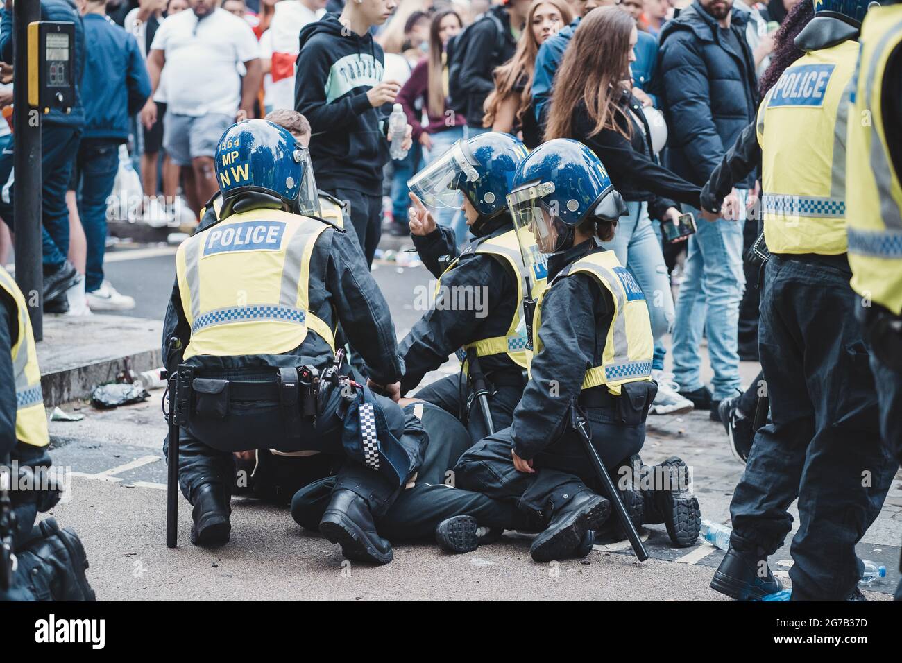 London | UK - 2021.07.12: Police officers arresting two aggressive men ...