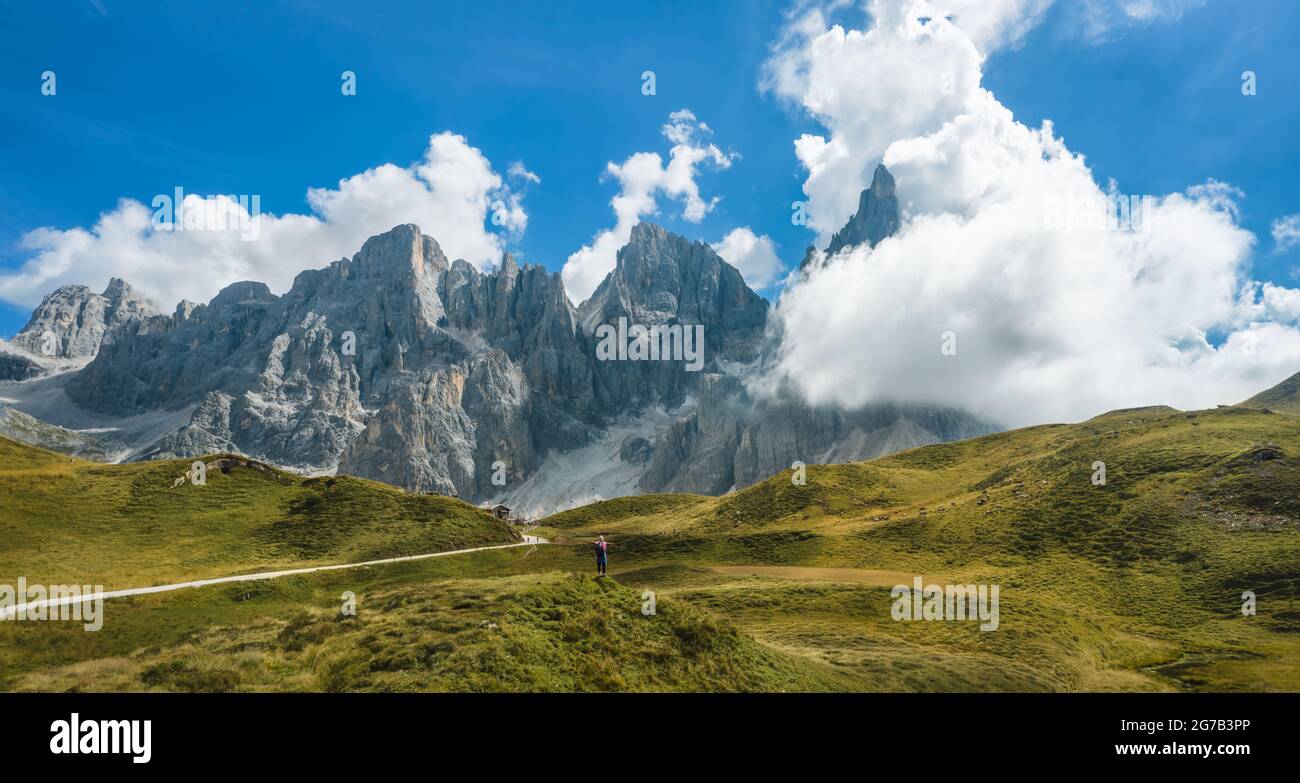 Dolomites. Woman on top hill - Baita Segantini mountain with Cimon ...