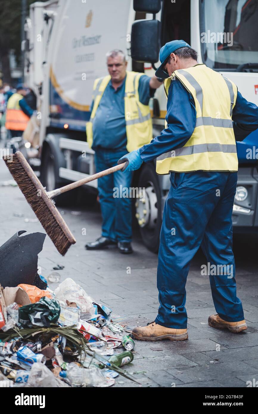 London | UK - 2021.07.12: Street cleaners sweepers in SOHO cleaning ...