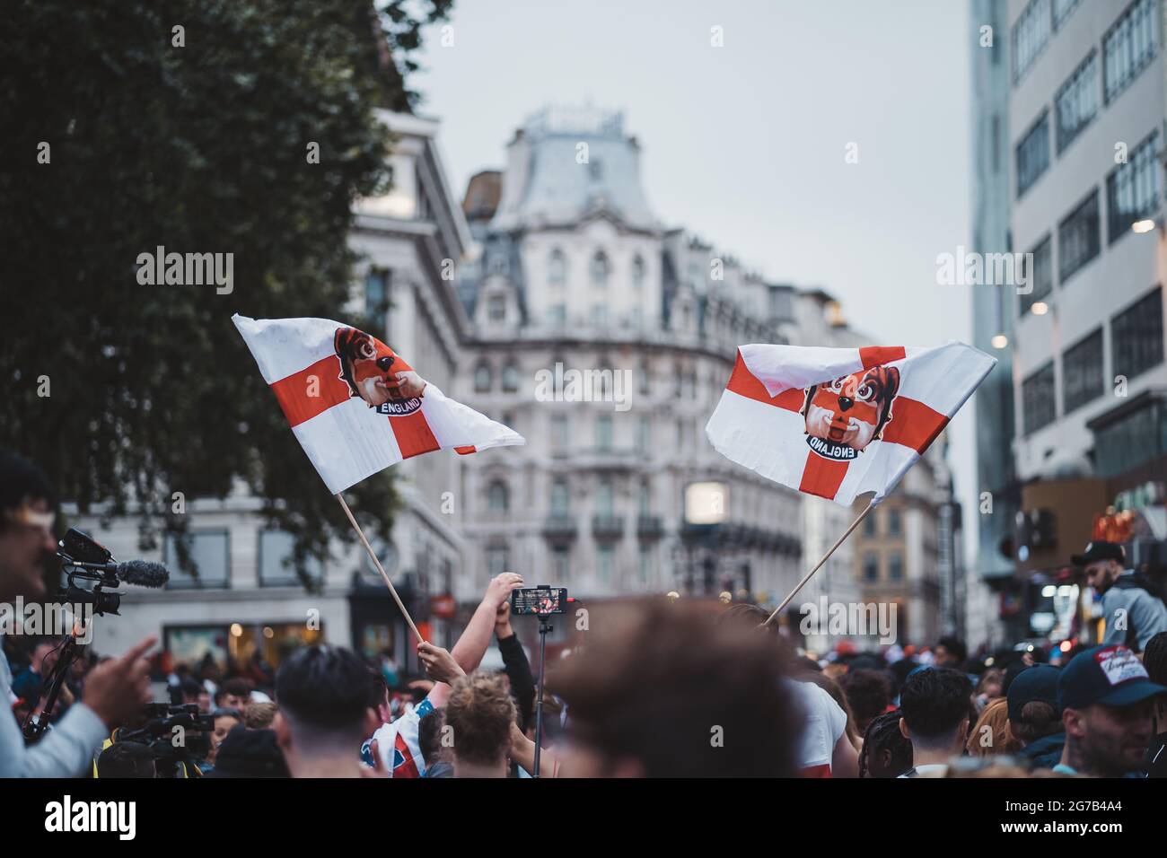 London | UK - 2021.07.12: English fans waving flags at Leicester Square ...