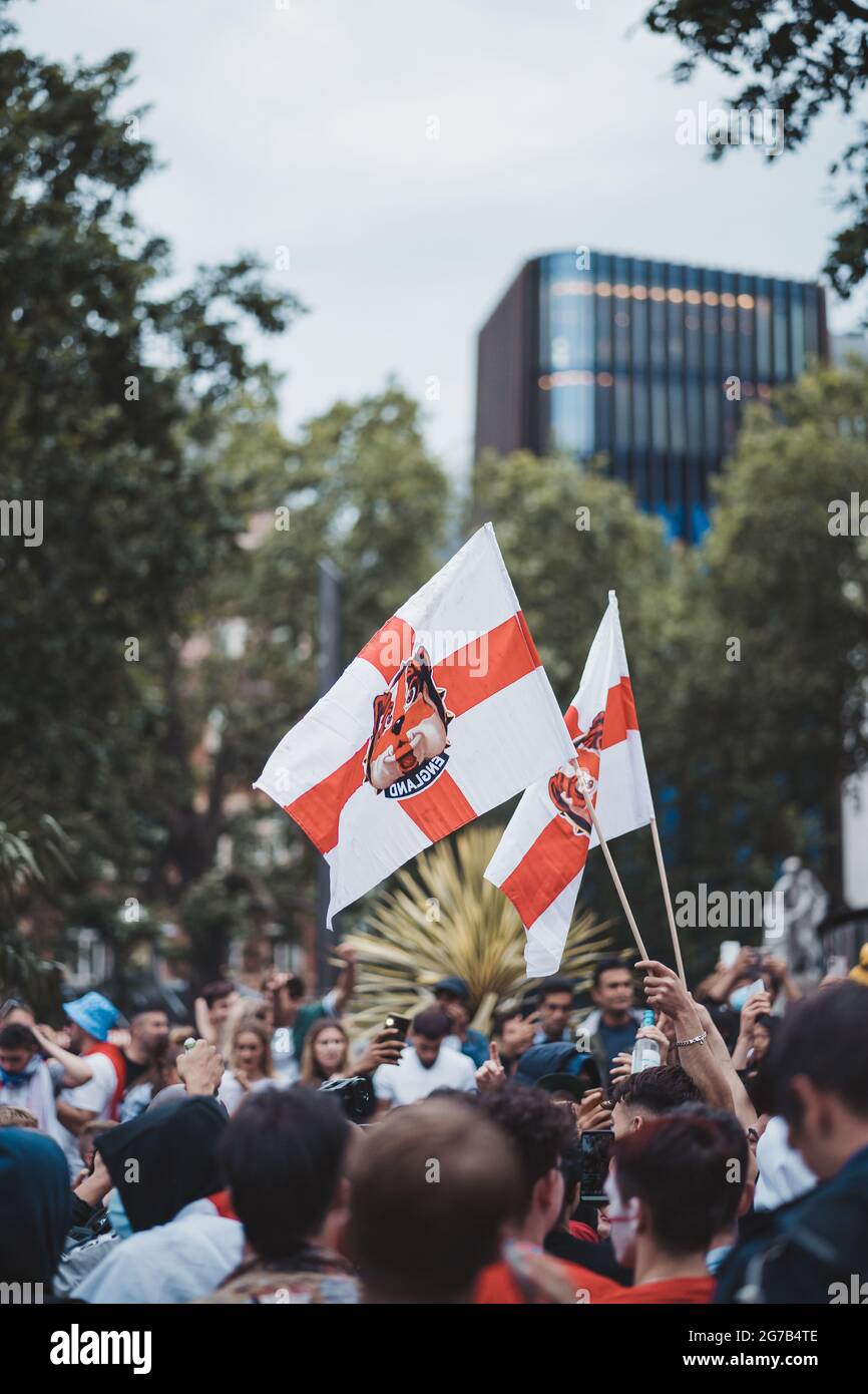 London | UK - 2021.07.12: English fans waving flags at Leicester Square ...