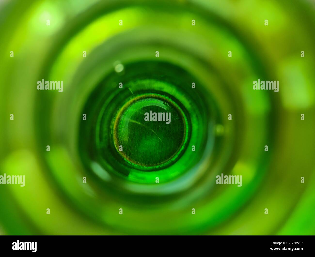 inside a green glass bottle. Close-up view at the bottom of the bottle ...